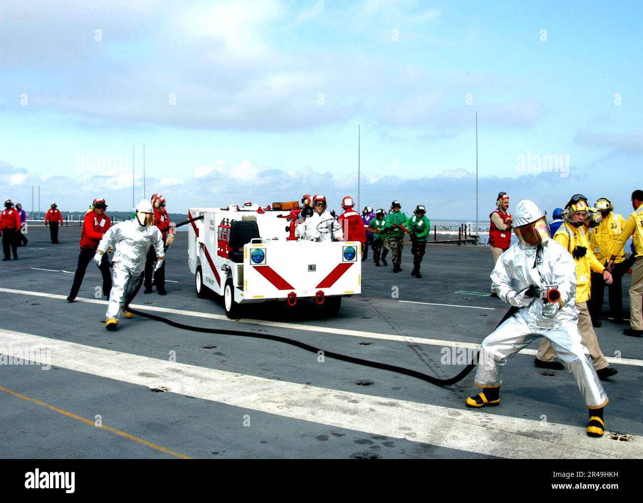 US Navy A senior nozzleman contains a fire on an F-14 Tomcat until the ...