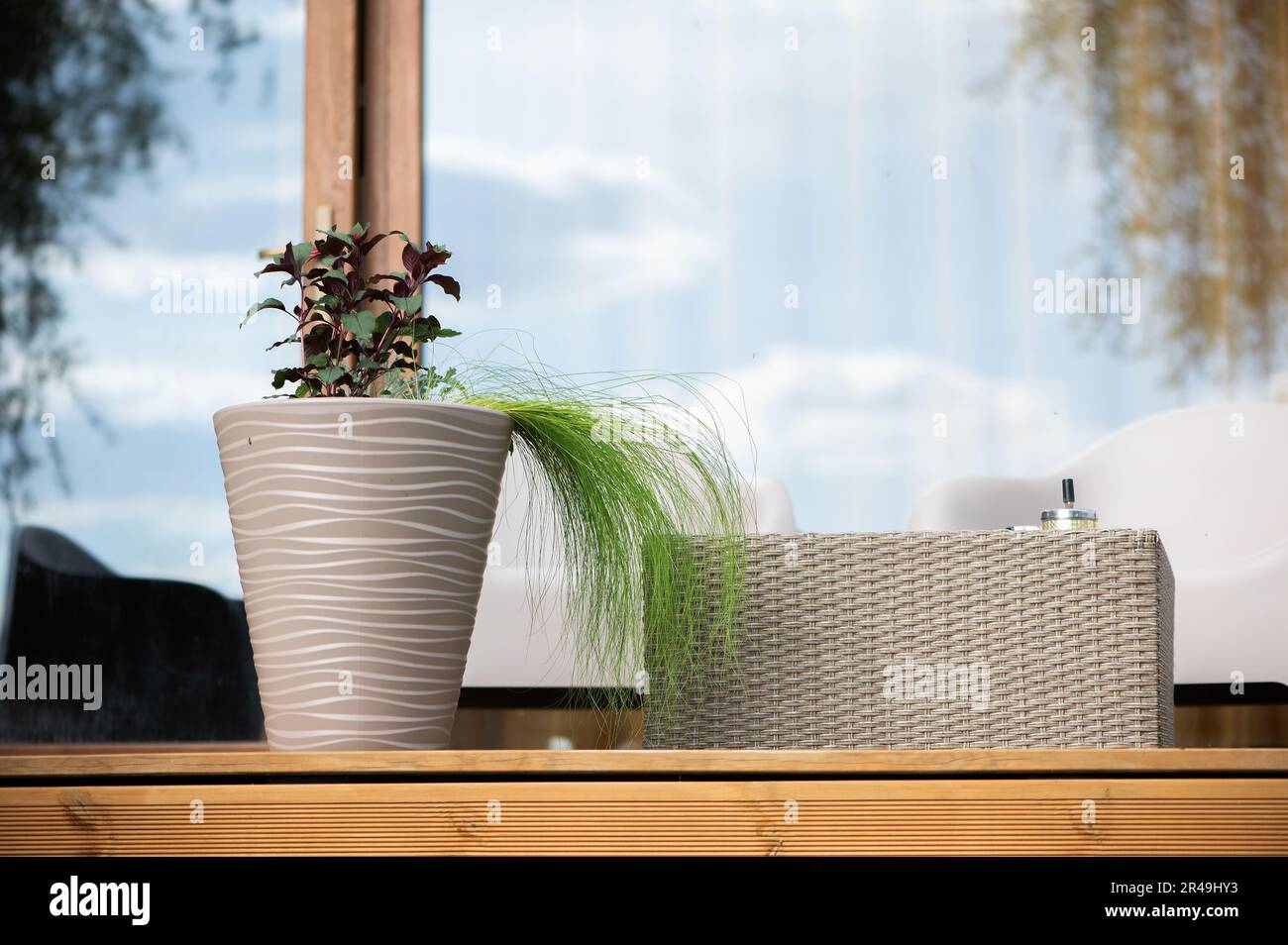 Wooden window sill featuring a vintage style ceramic vase in a ...