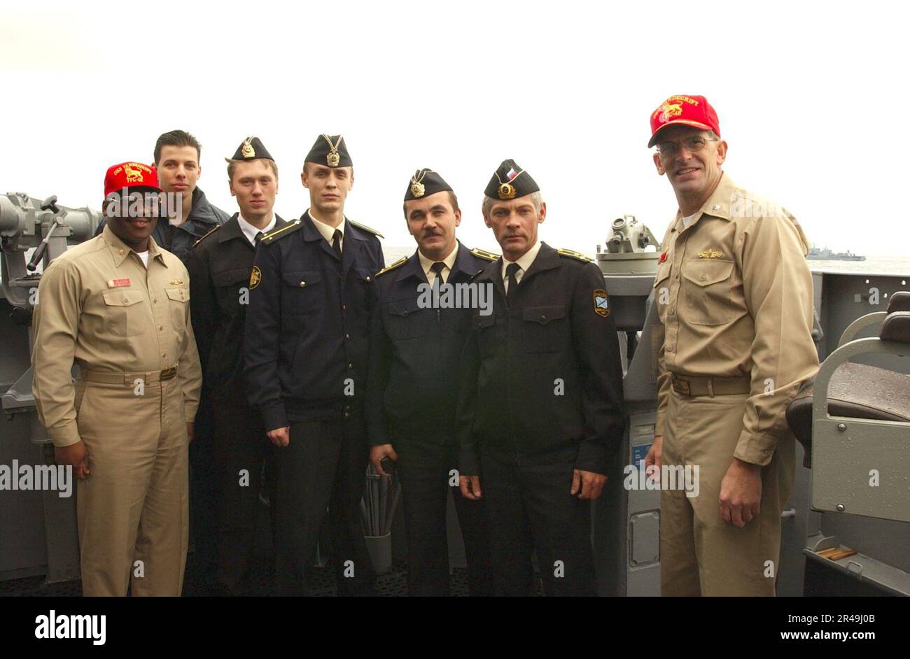 US Navy Russian Federation Navy Officers pose for a picture with ...