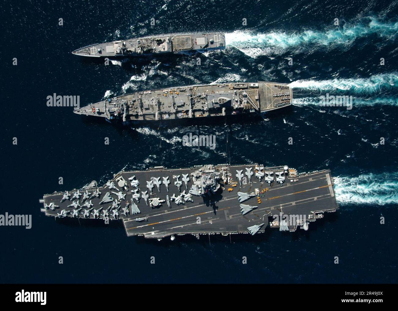 US Navy The guided missile cruiser USS Gettysburg (CG 64), top, and the ...