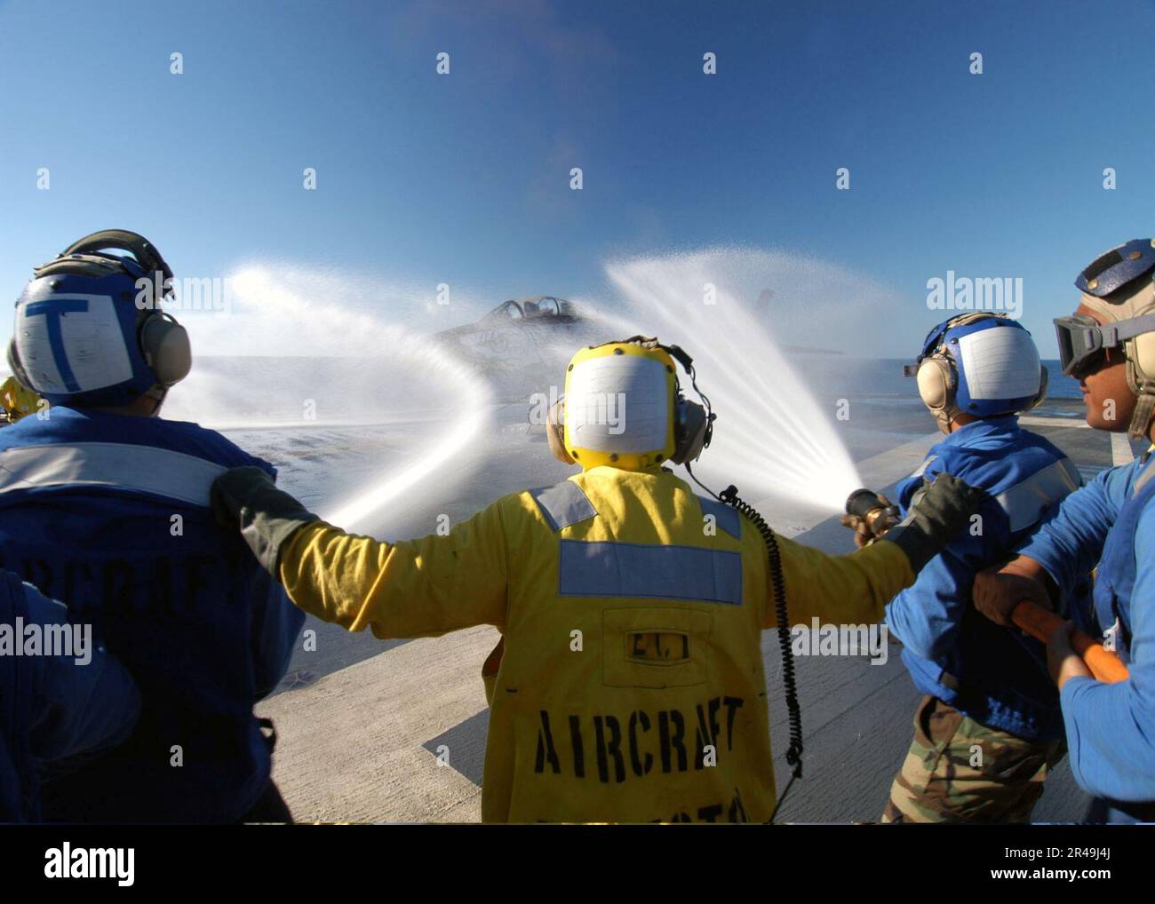 US Navy An Aircraft Director aboard the conventionally powered aircraft ...