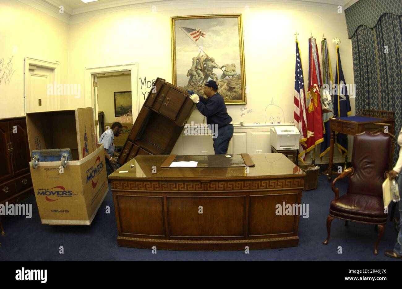 US Navy Office Mover employees move a credenza Stock Photo - Alamy