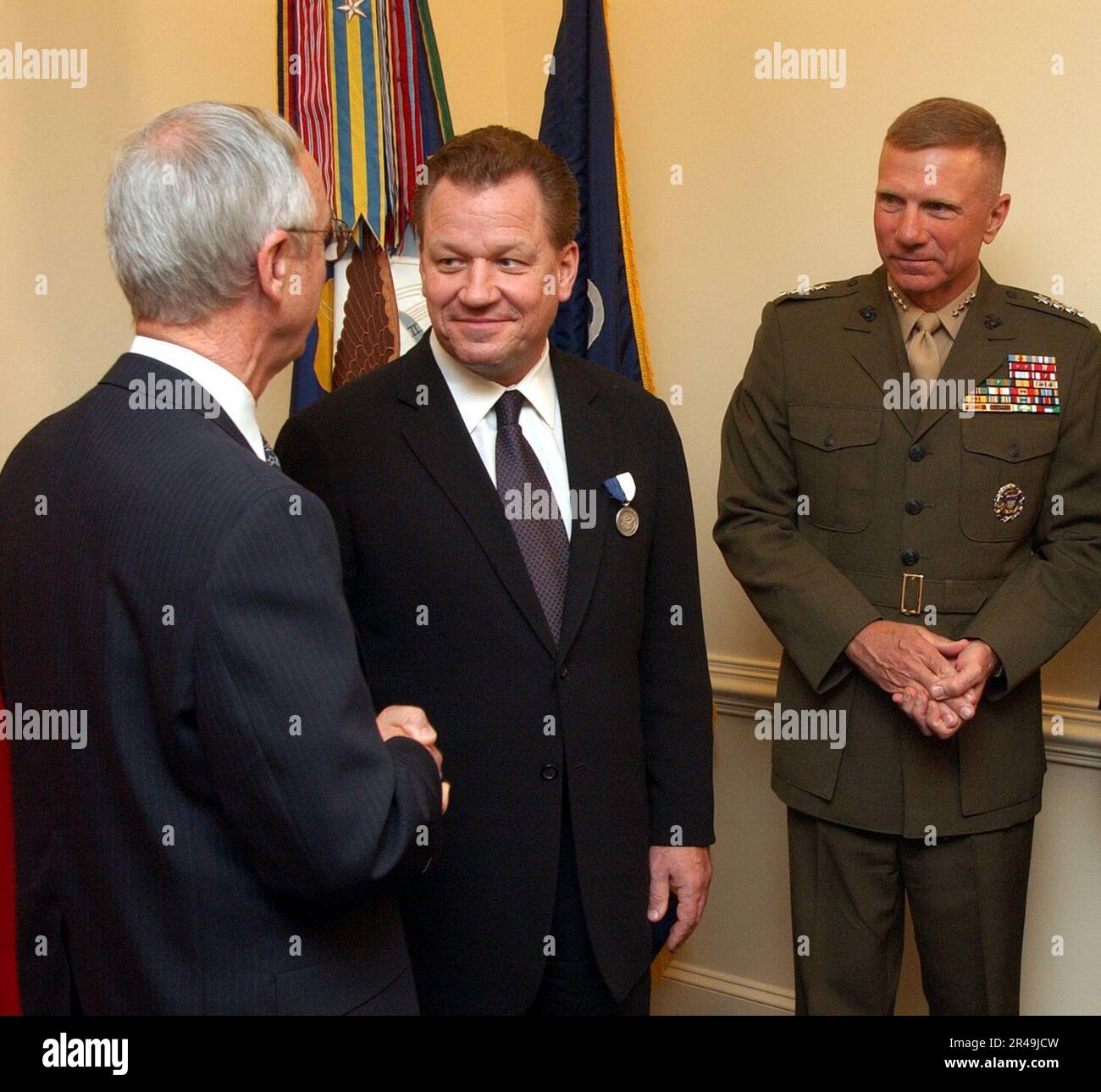 US Navy Secretary of the Navy Gordon R. England presents author James ...