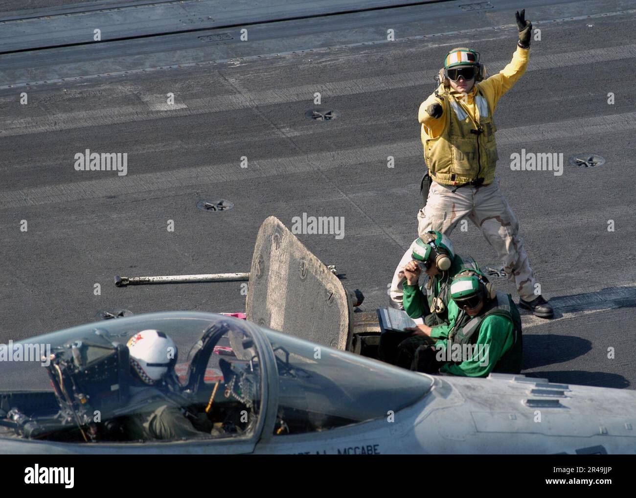 US Navy A shooter signals to the pilot Stock Photo - Alamy