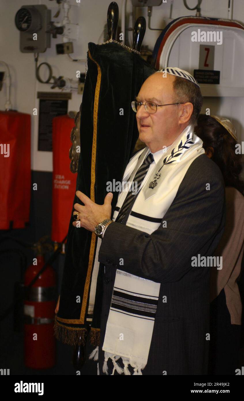 US Navy Rabbi Michael A. Oppenheimer carries a 300-year-old Torah Stock ...