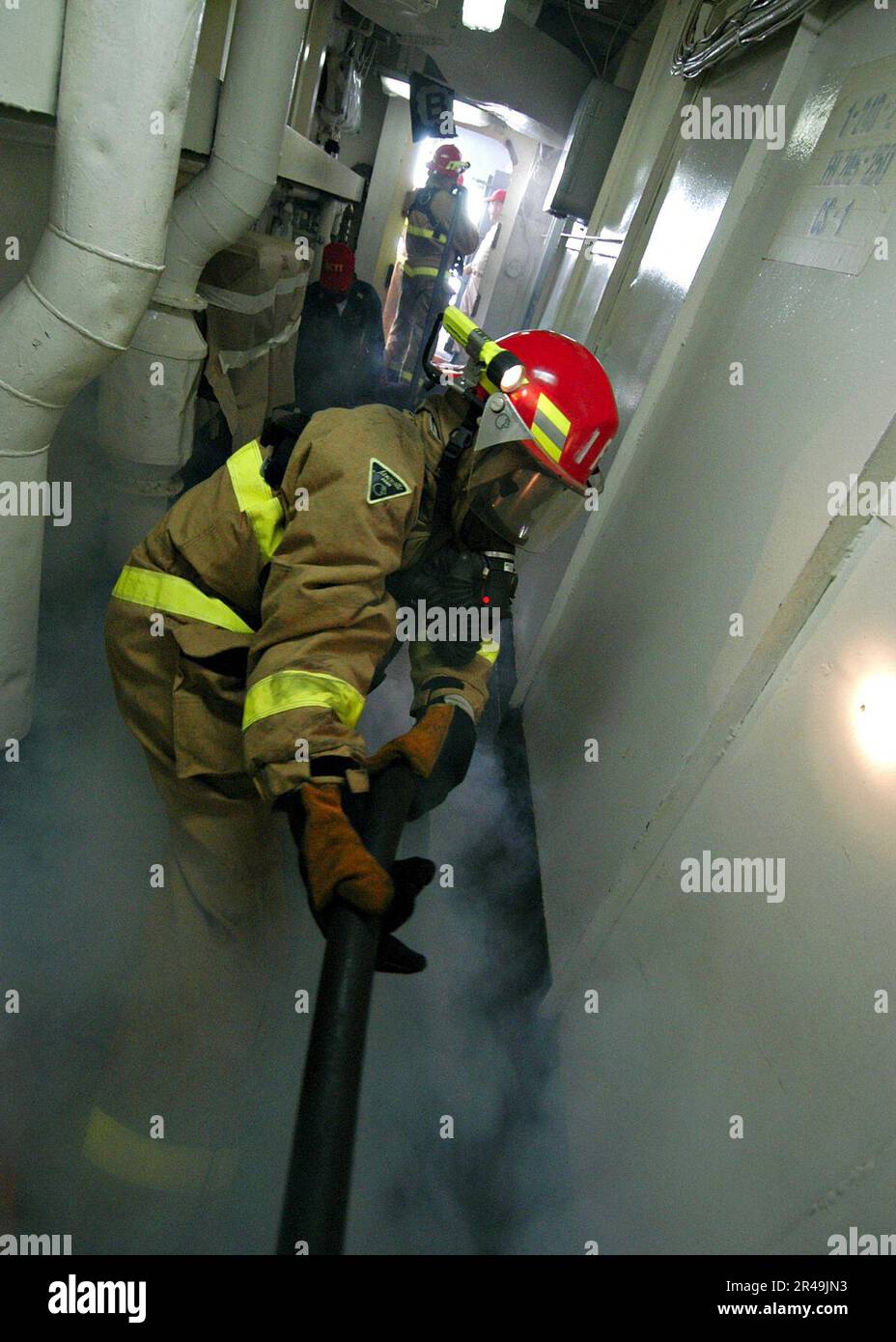 US Navy A Sailor assigned to Repair Locker One Foxtrot aboard USS ...