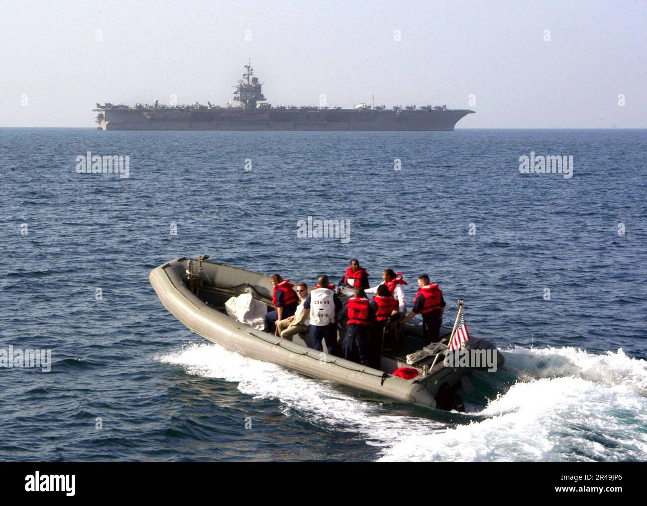 US Navy A Rigid Hull Inflatable Boat (RHIB) makes its way back to USS ...