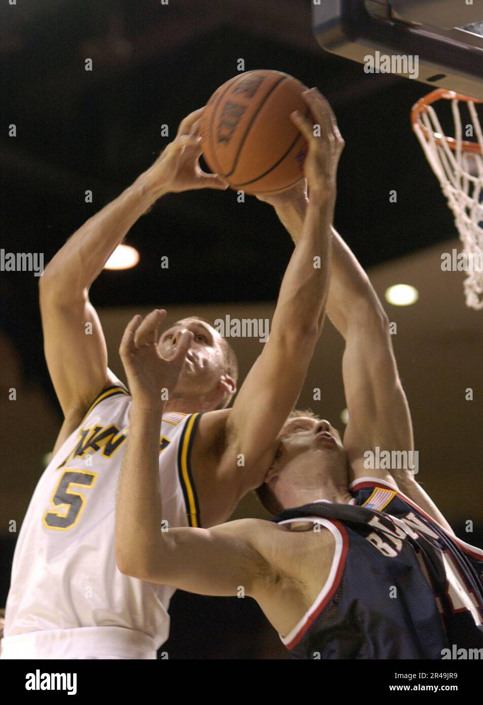 US Navy Navy sophomore guard David Hooper pulls down a rebound over ...