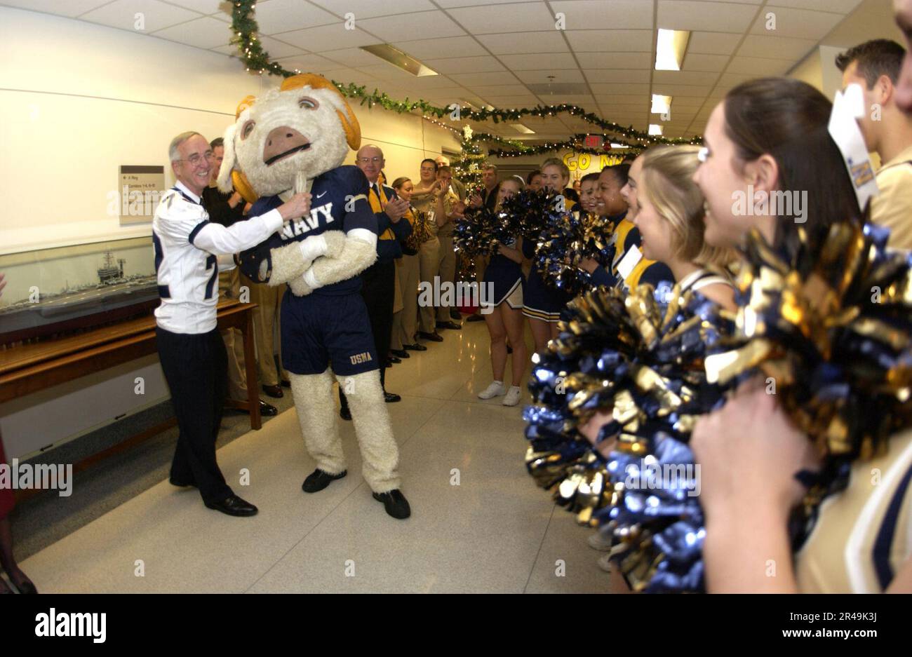 US Navy The Secretary of the Navy, the Honorable Gordon R. England tugs ...