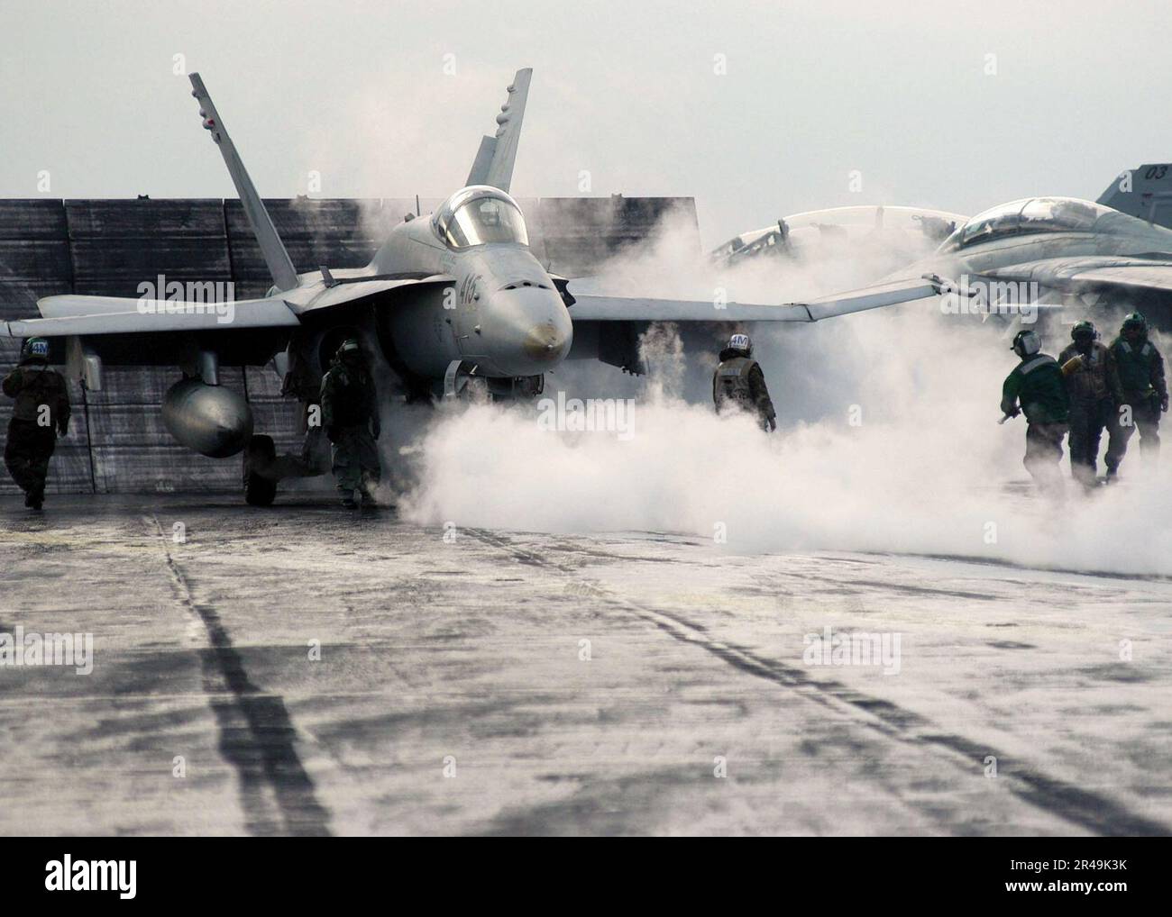 US Navy As steam from a previous launch billows out of the catapult ...