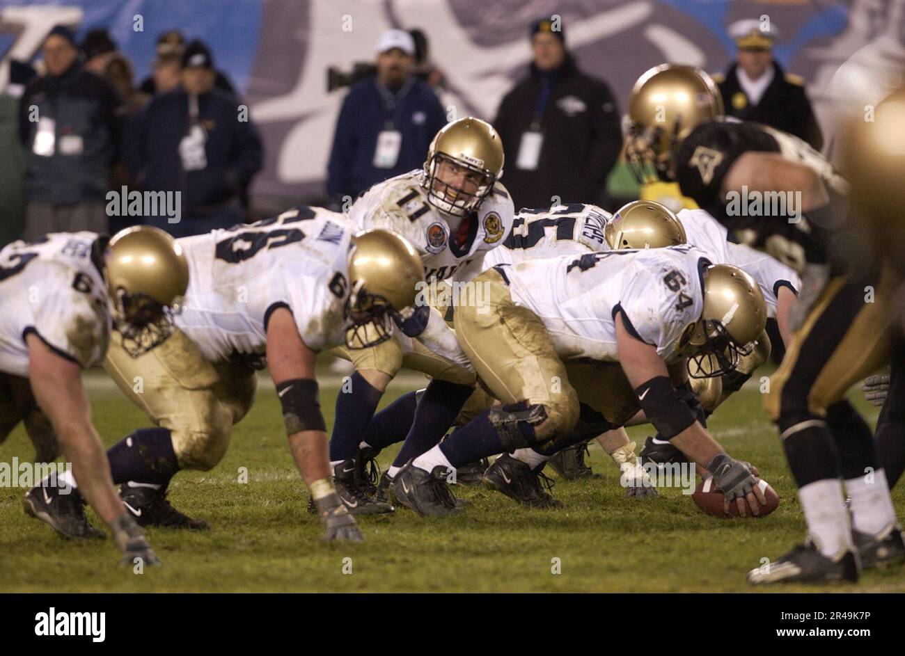 US Navy Quarterback calls signals before getting the snap from his ...