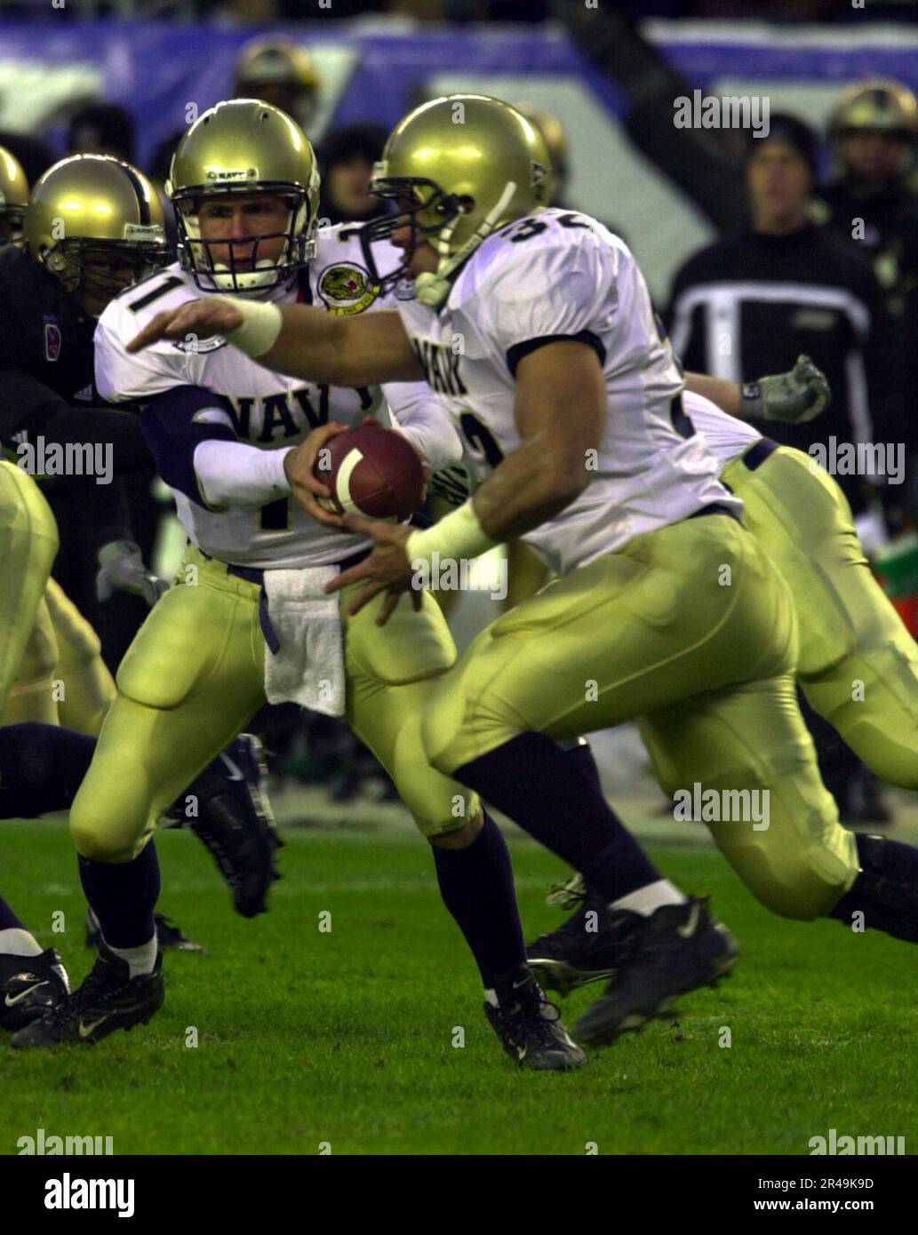 US Navy Navy quarterback hands off to fullback during the 104th playing ...