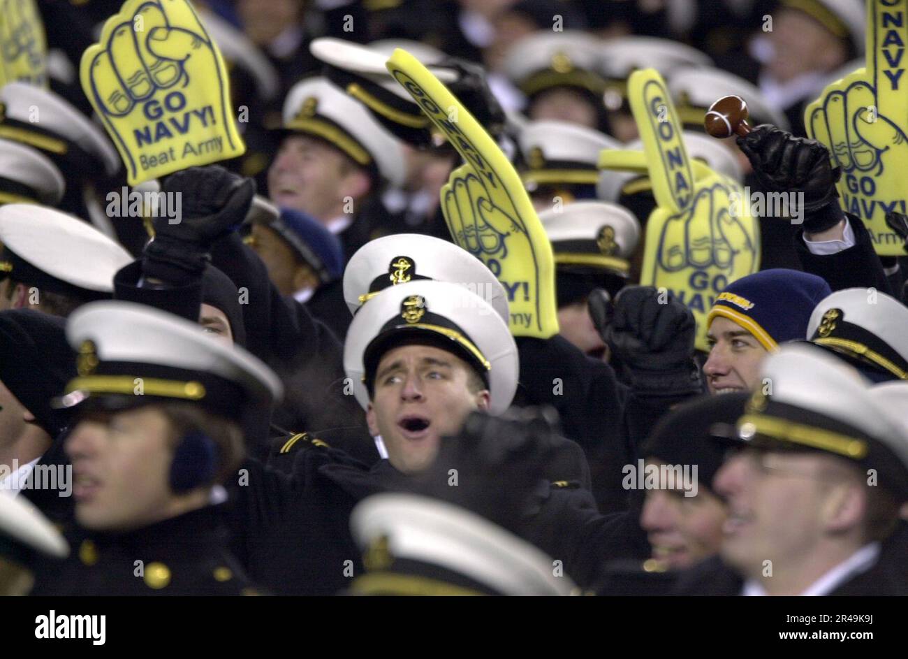 US Navy U.S. Naval Academy Midshipmen cheer for their football team during the 104th Army Navy ...