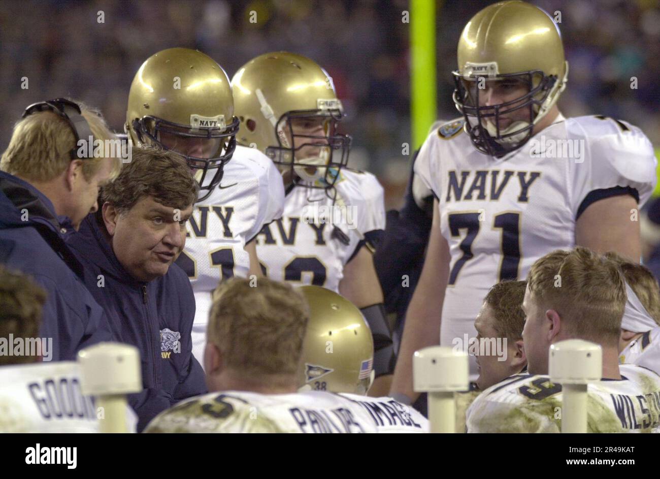 US Navy Navy head coach talks to the offensive line during the 104th ...