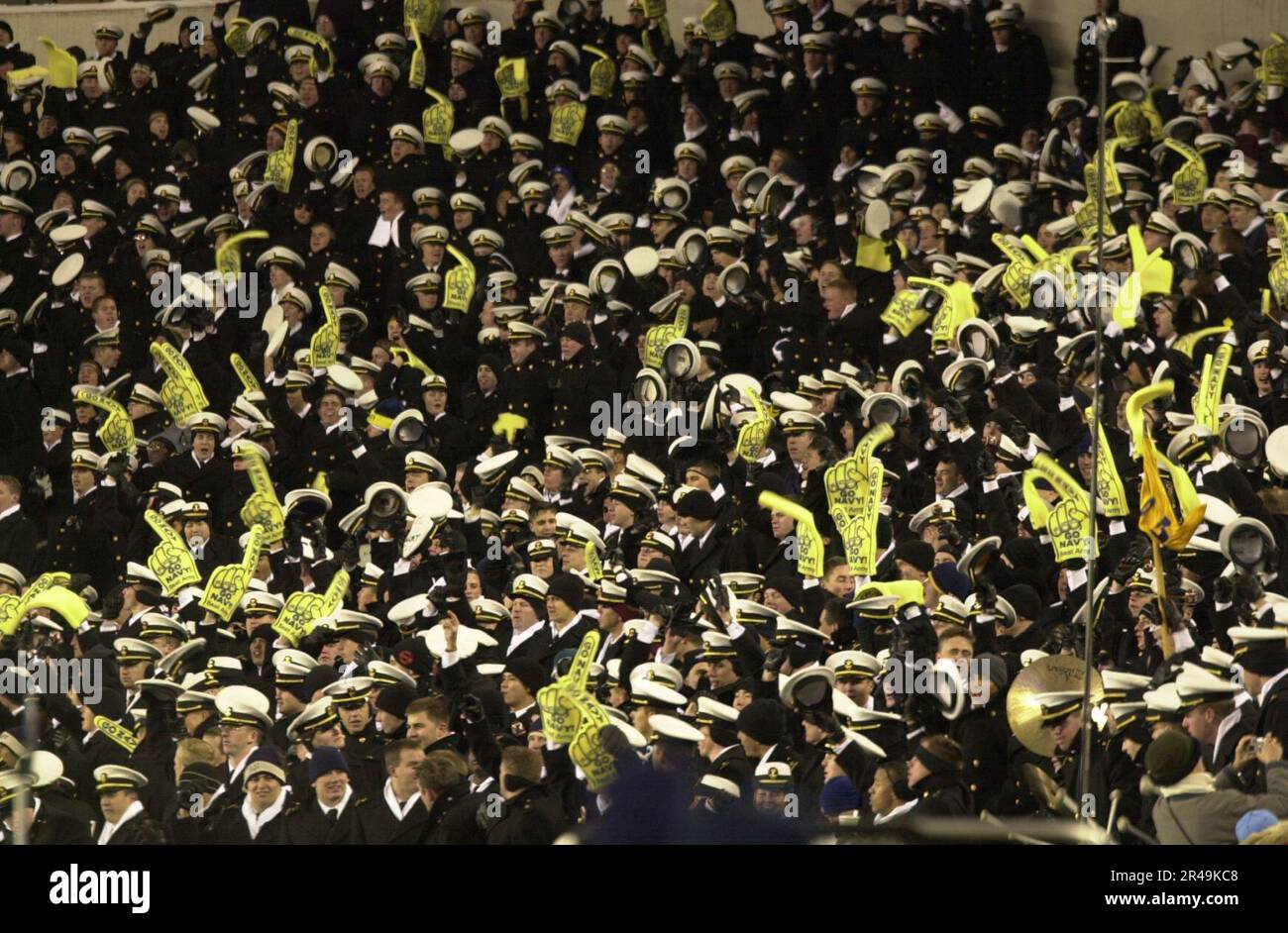 US Navy The U.S. Naval Academy Brigade of Midshipmen cheers for their ...