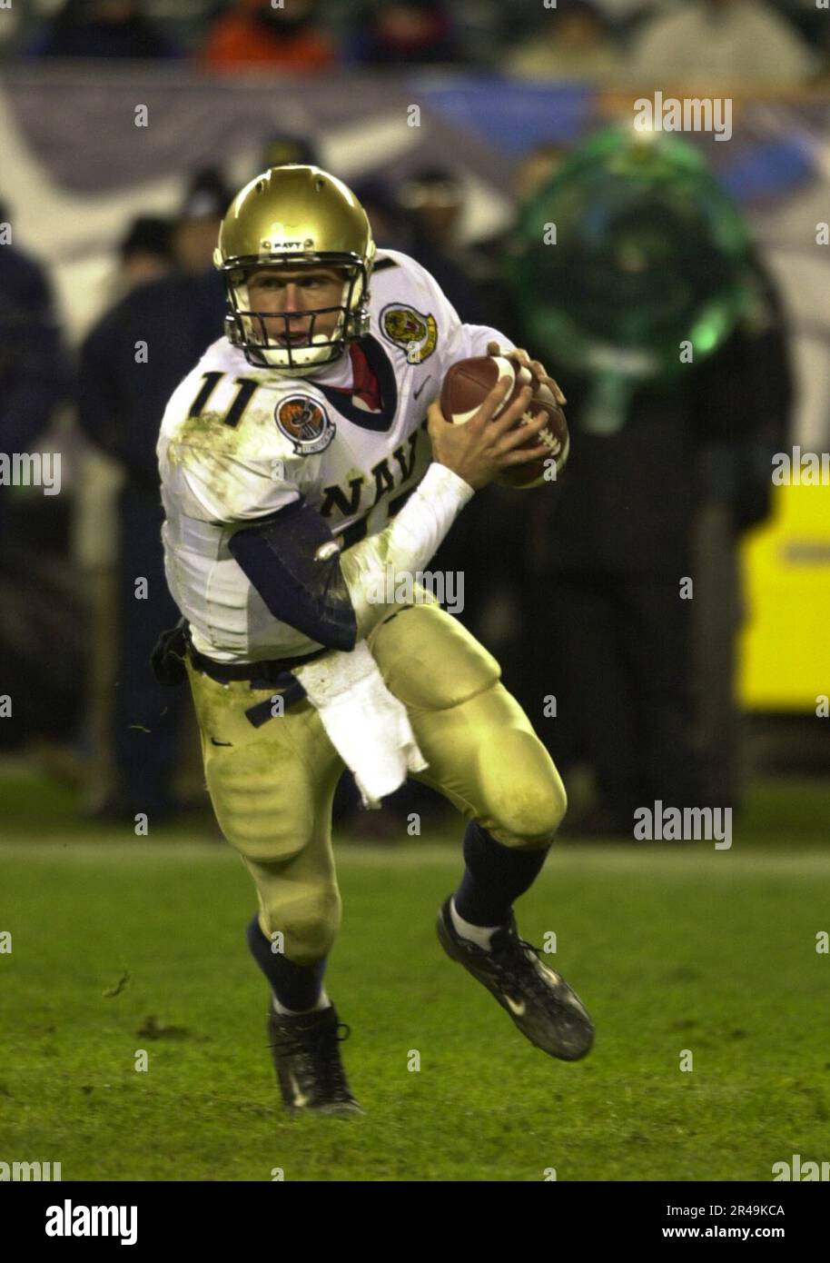 US Navy Navy quarterback looks for a receiver downfield during the ...