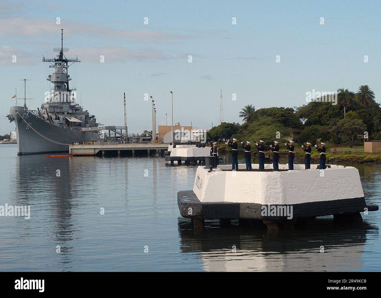 US Navy Members of the U.S. Marine Corps Rifle Detail perform a 21-gun ...