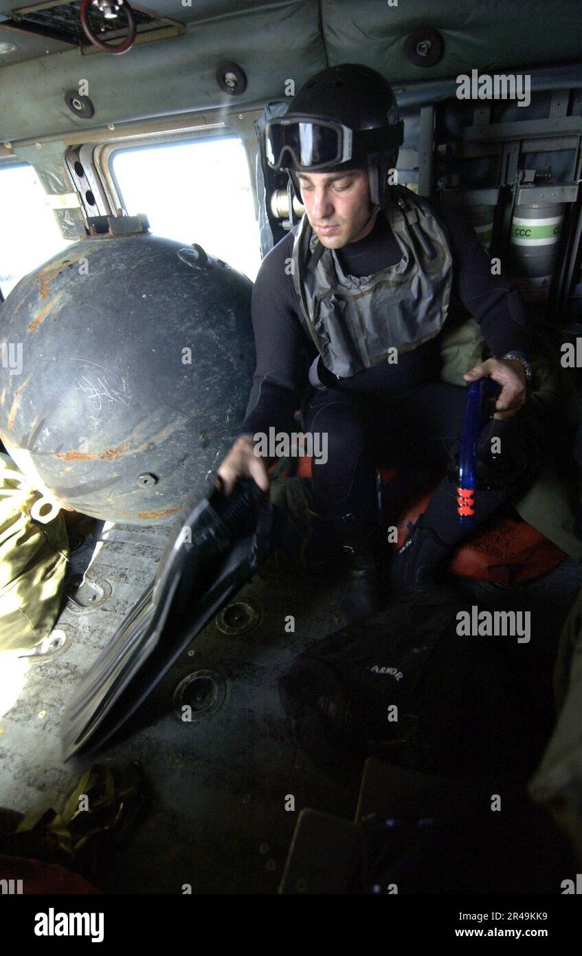 US Navy Gunner's Mate 1st Class assigned to Explosive Ordnance Disposal ...