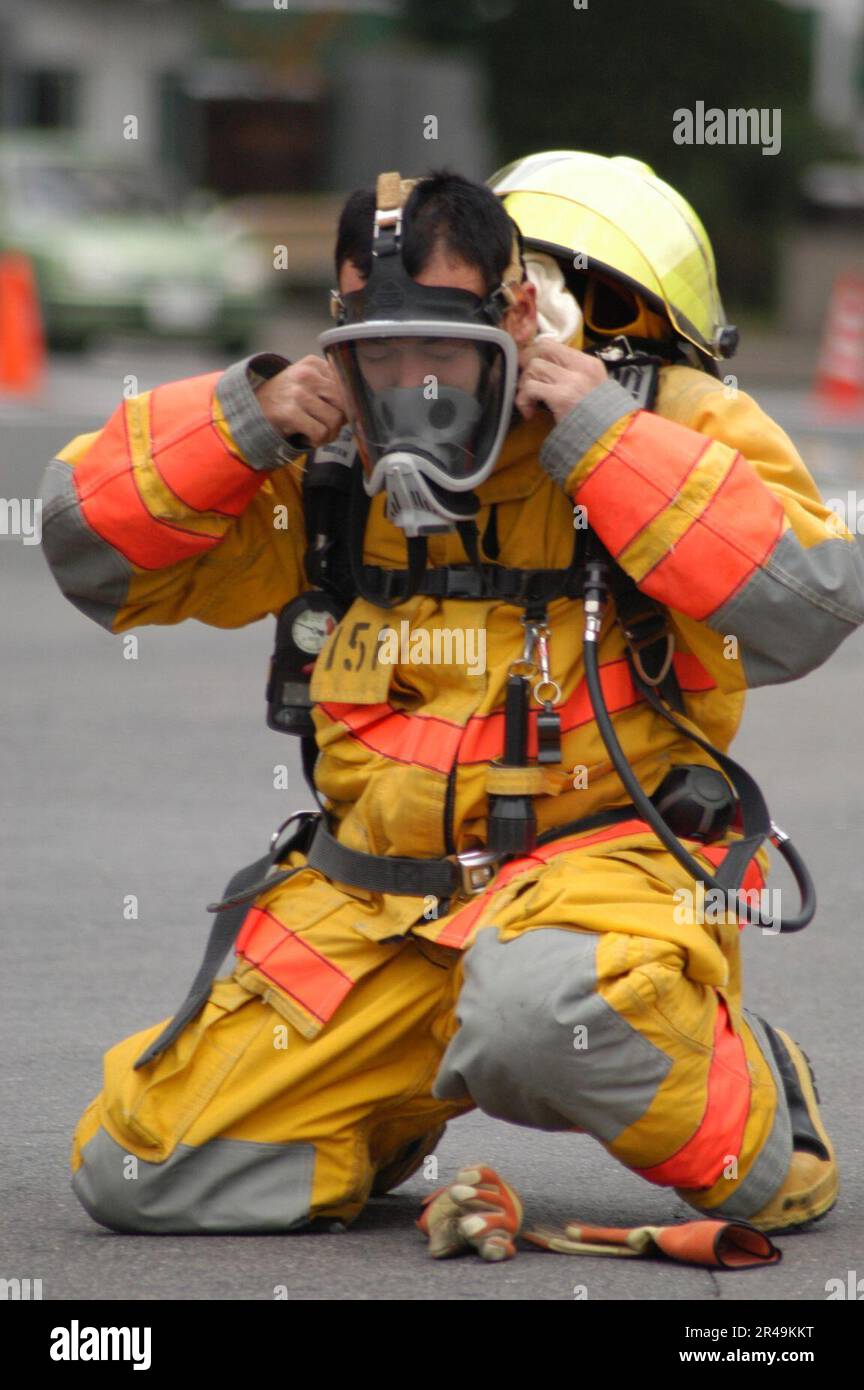 US Navy A fire fighter assigned to Commander U.S. Naval Forces Japan ...