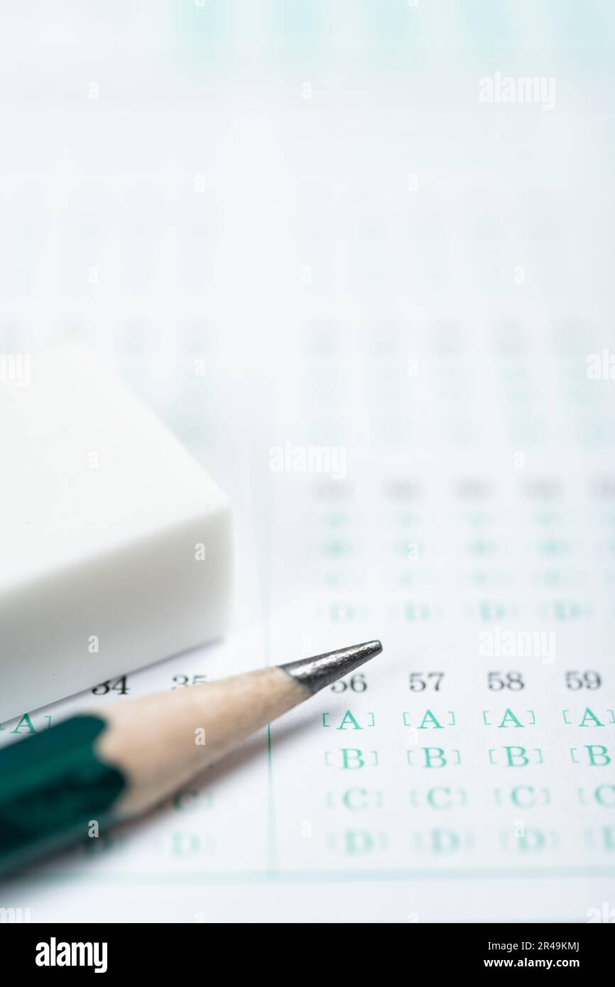 angle view test score sheet and pencil and eraser close up vertical ...