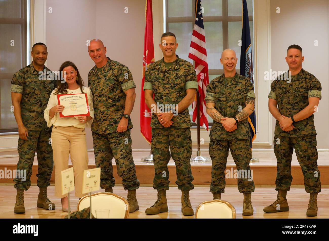 U.S. Marines pose for a photo with volunteer Lindsey Knowles at the ...