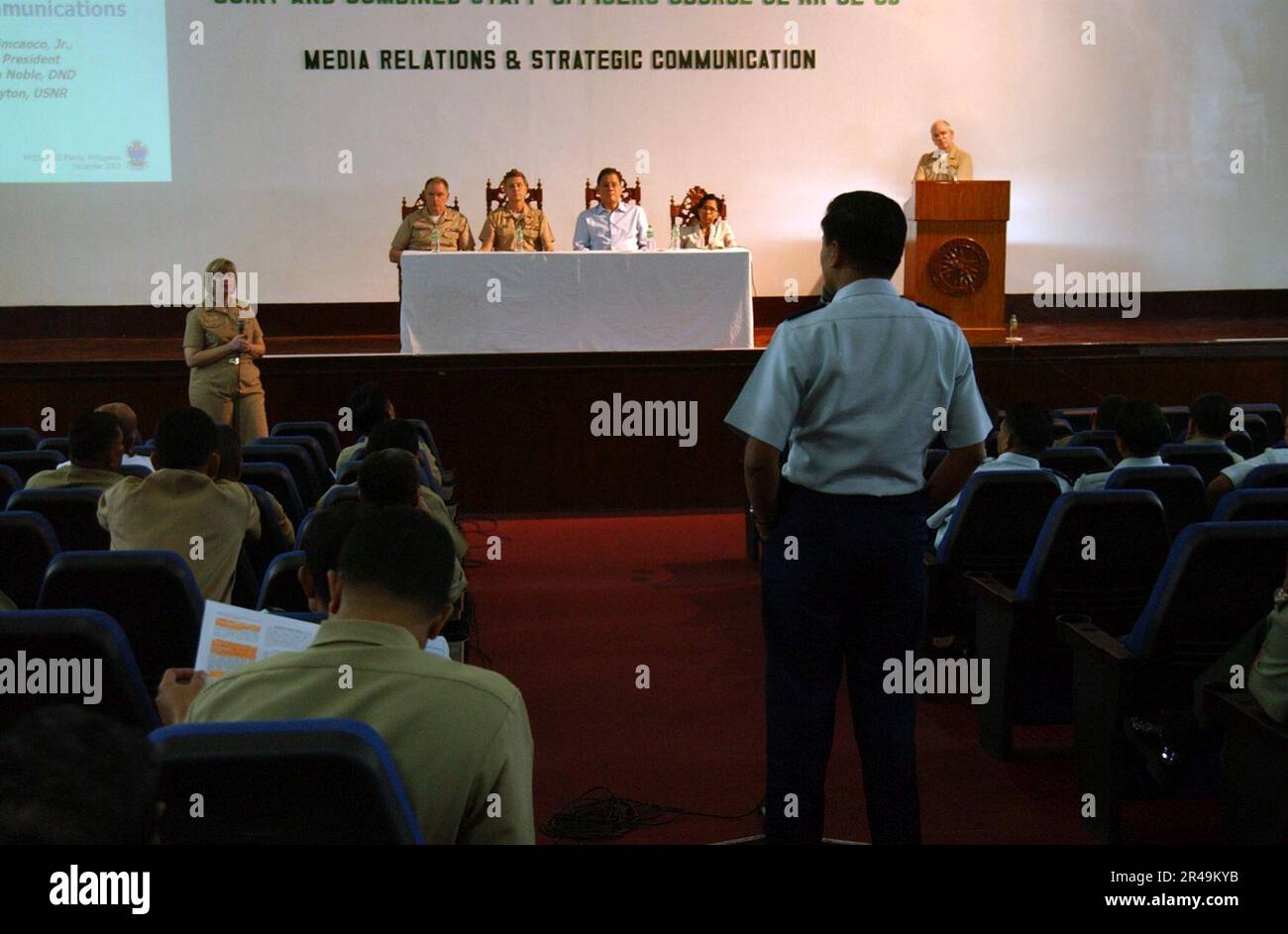 US Navy Reservists participate in a communication session with a class ...