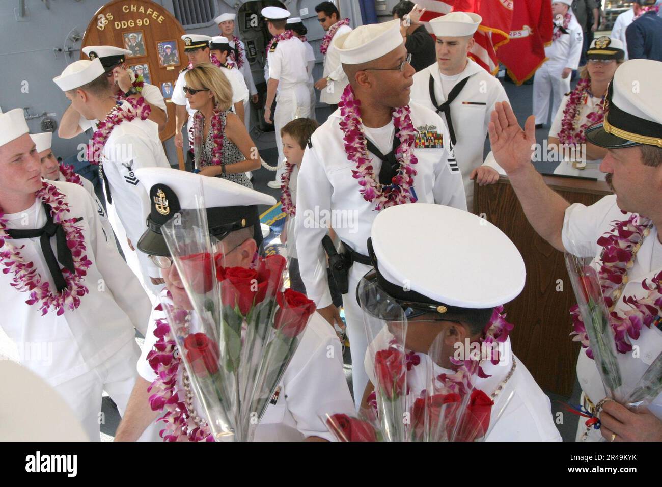 US Navy Sailors eagerly go ashore aboard the newly-commissioned guided ...