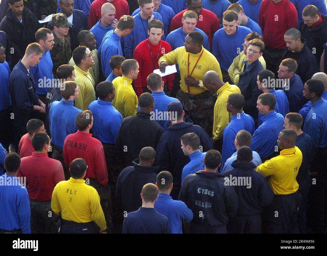 US Navy Flight deck personnel muster with Aviation Boatswain's Mate 1st ...
