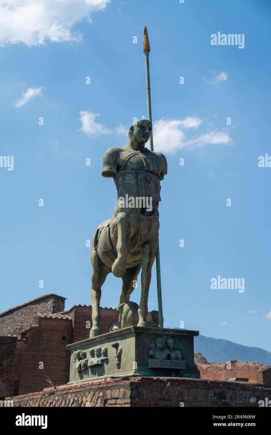 A distressed large-scale sculpture of a Centaur missing its head and ...