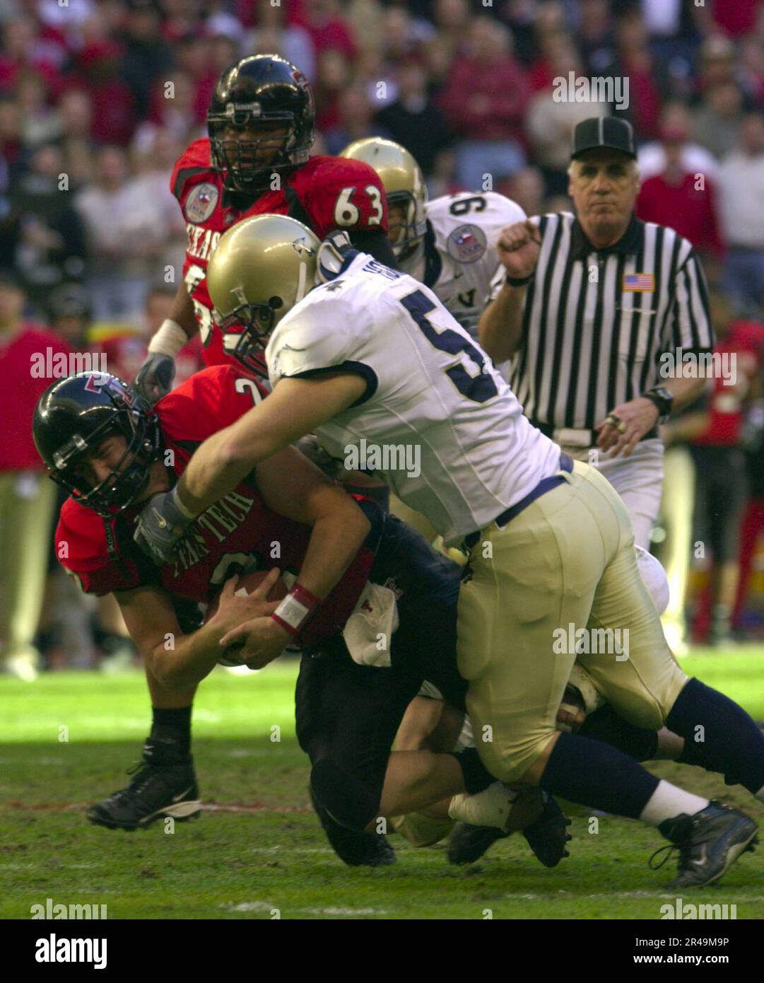 US Navy Navy linebacker sacks Texas Tech quarterback during the EV1.Net ...