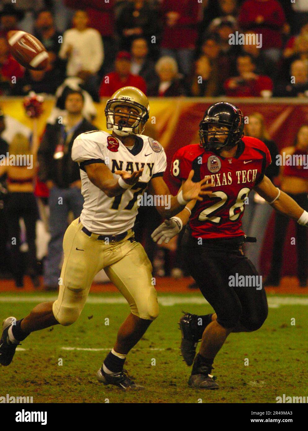 US Navy Navy wide receiver jockeys for position on a pass play against ...