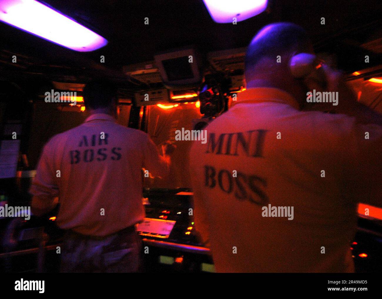 US Navy Air Officer or Air Boss Cdr. supervise flight operations with ...