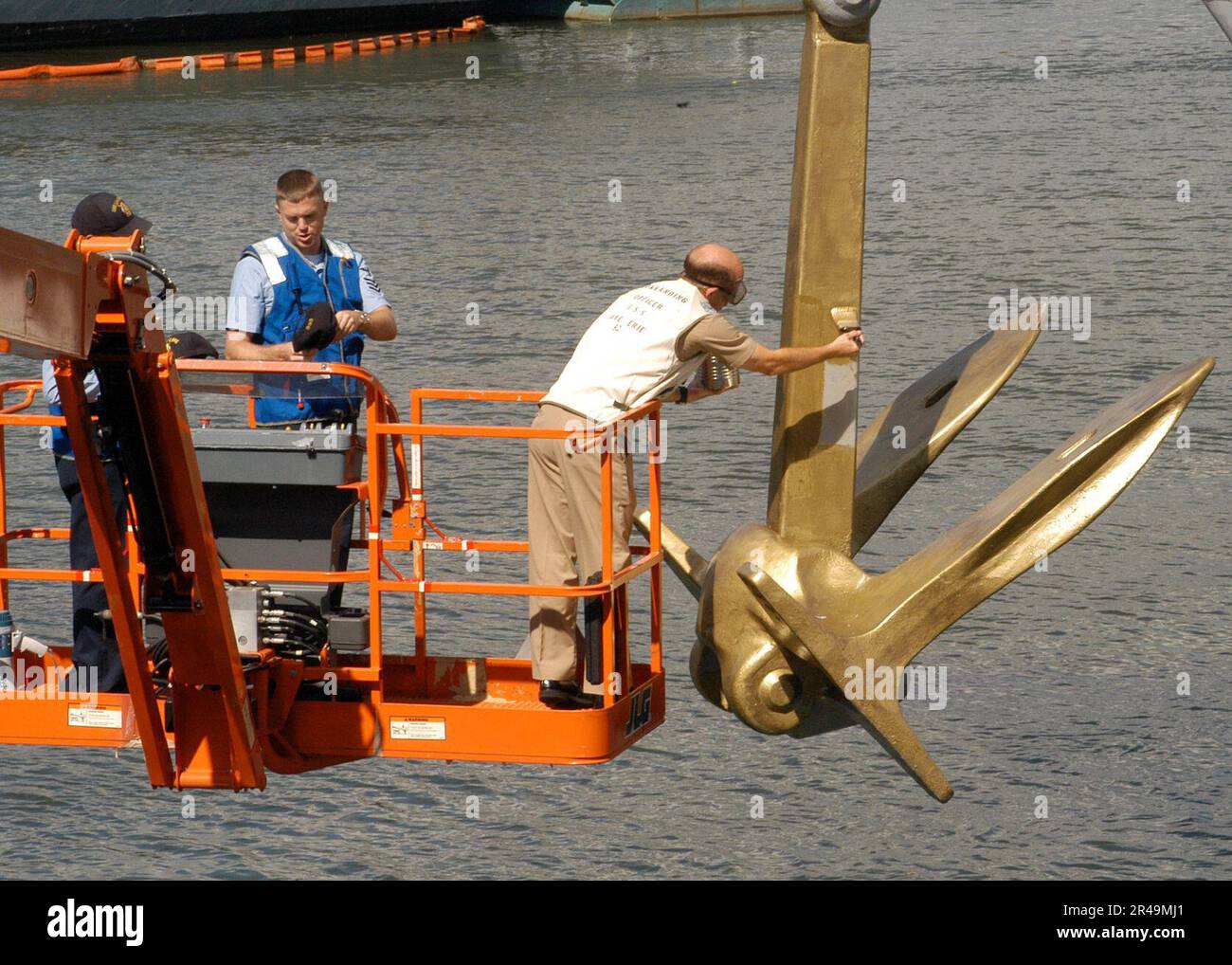 US Navy Capt. Commanding Officer of USS Lake Erie (CG 70) applies gold ...