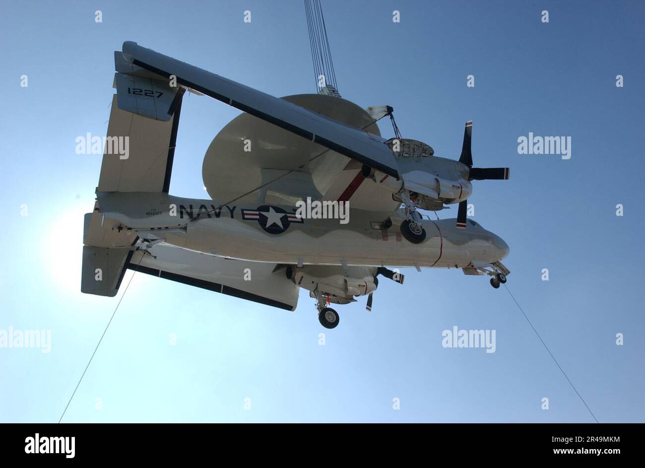 US Navy A retired E-2 Hawkeye is hoisted aboard the decomissioned ...