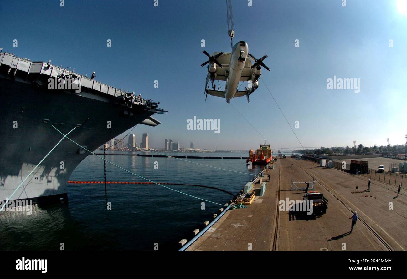 US Navy A retired E-2 Hawkeye is hoisted aboard the decomissioned ...