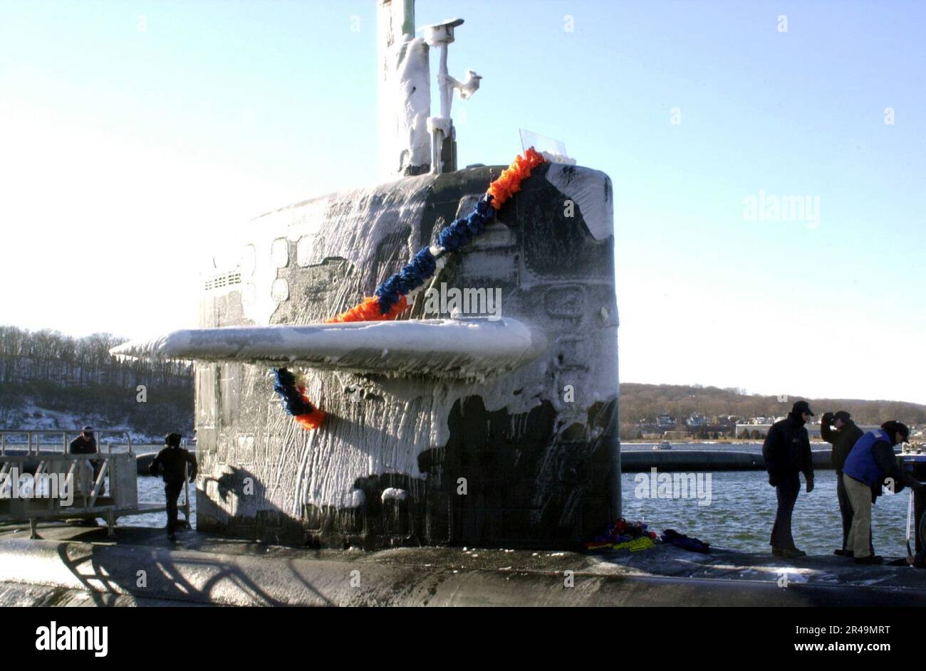 US Navy A sheet of ice covers the sail of the Los Angeles-class attack ...