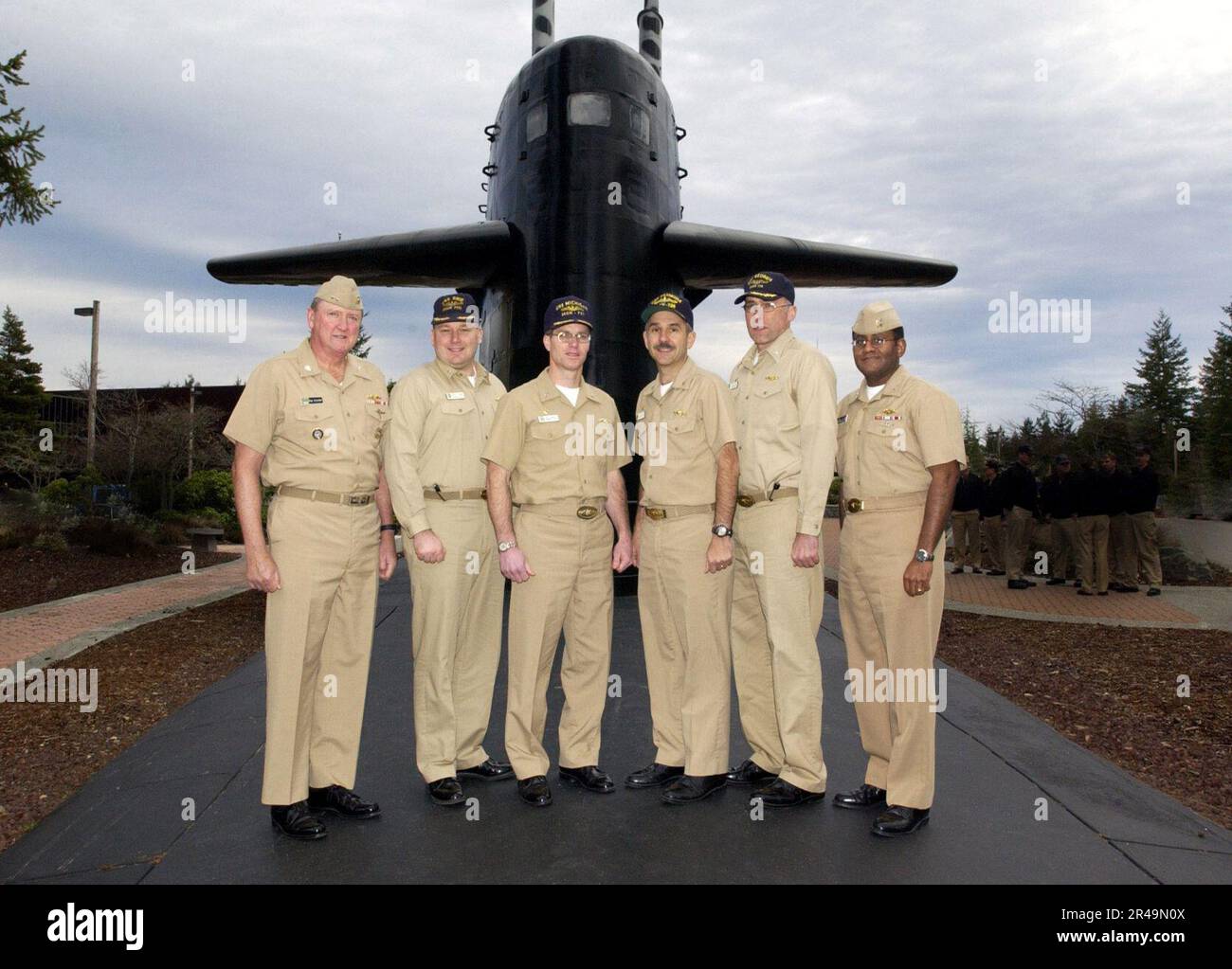US Navy From left to right, Rear Adm. Paul Sullivan, Commander ...