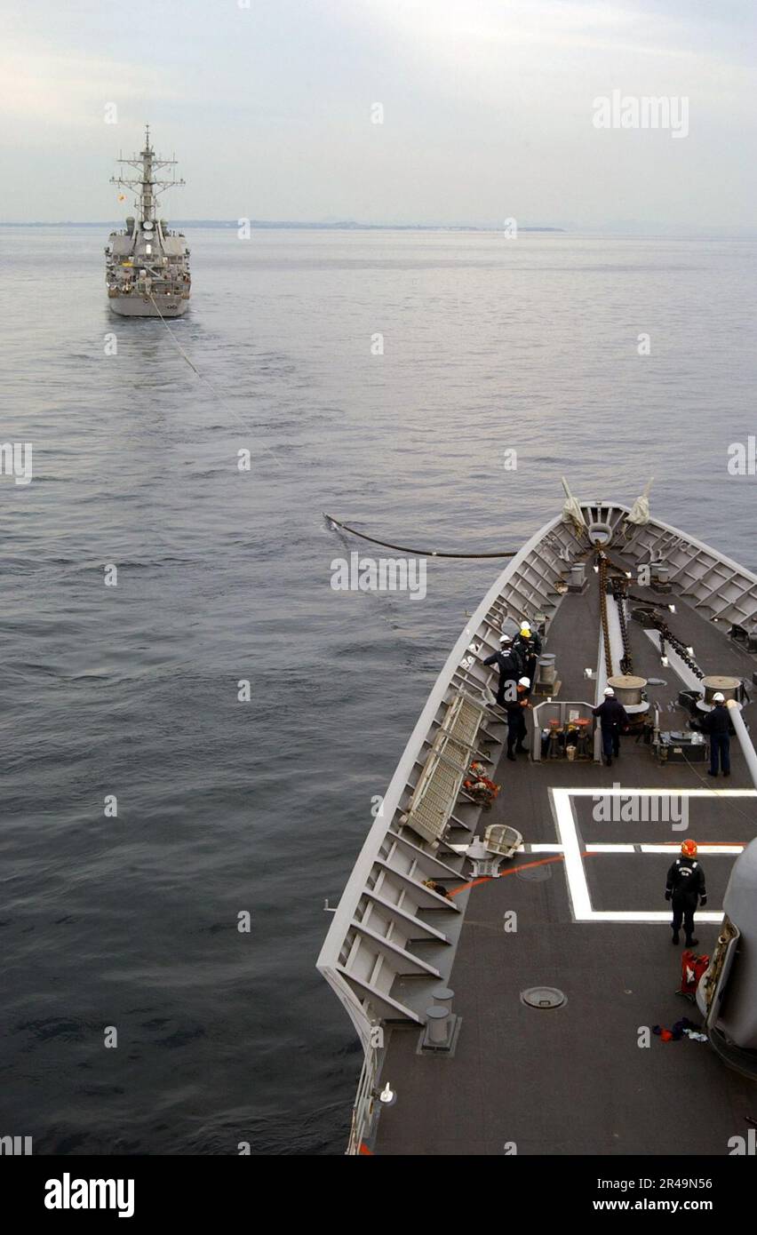 US Navy The guided missile destroyer USS John S. McCain (DDG 56) closes ...