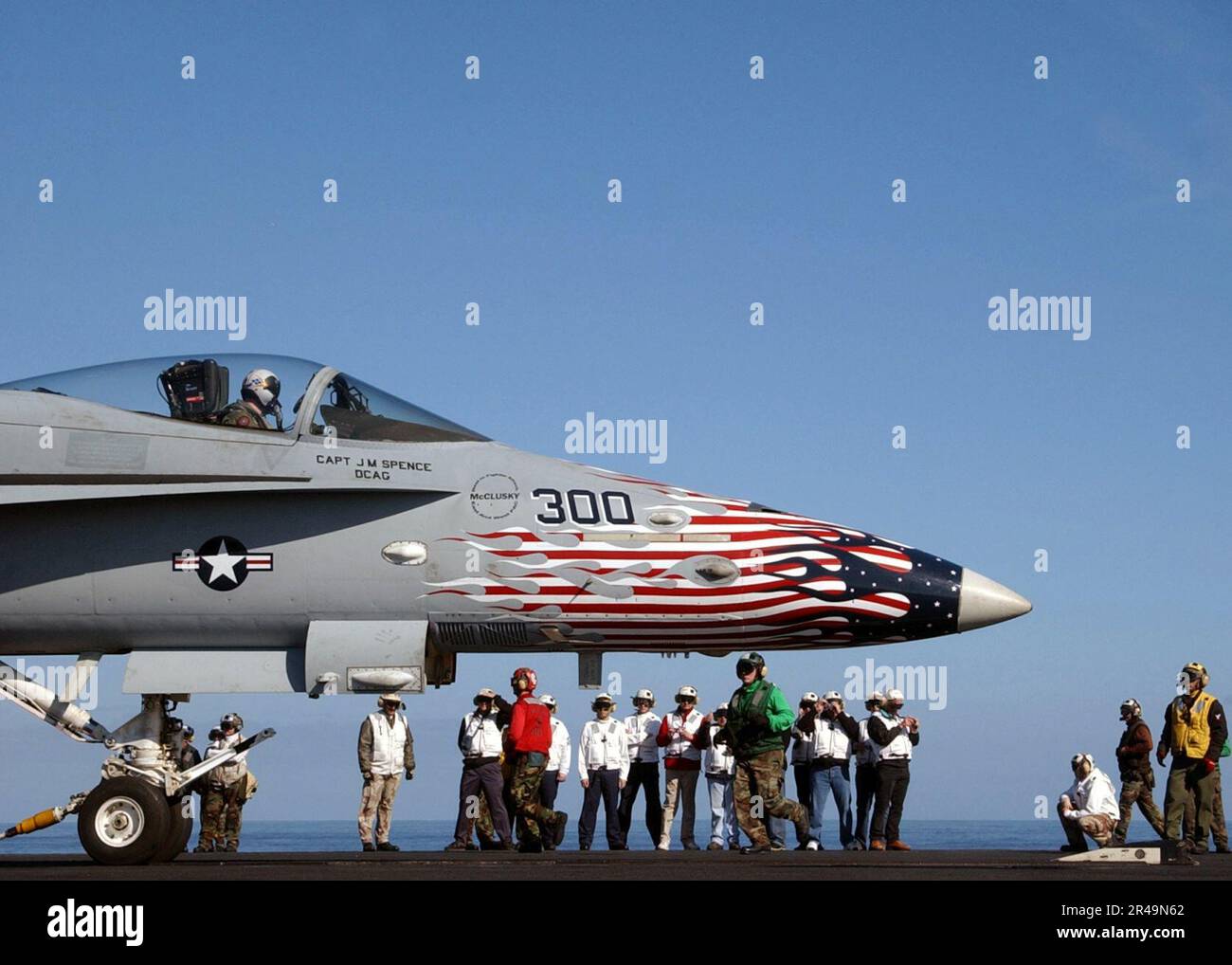 US Navy A group of distinguished visitors observe an F-A-18C Hornet ...