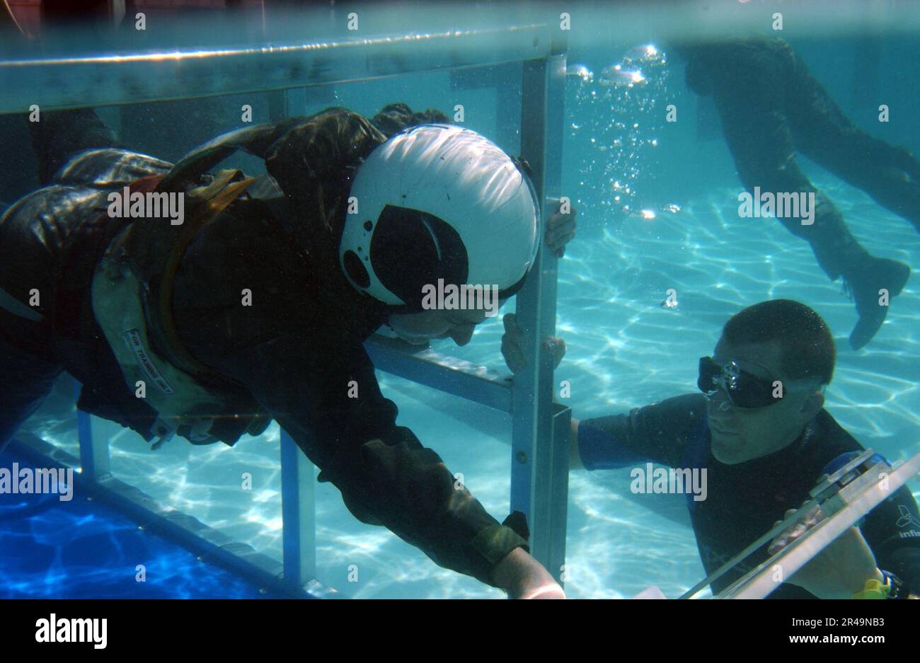 US Navy A student participating in the Aviation Water Survival Course ...