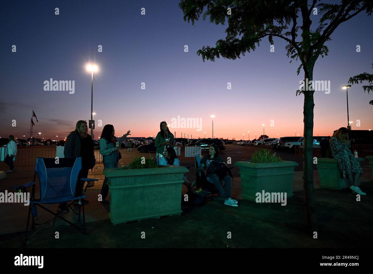 East Rutherford, USA. 26th May, 2023. During sunset, parents wait ...