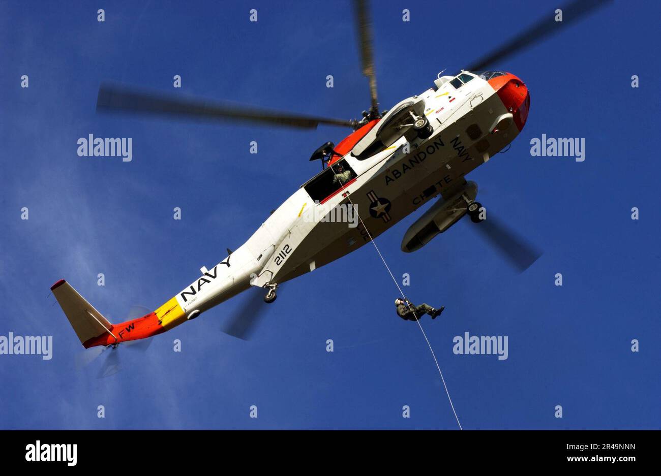 US Navy practices fast-rope repelling from a U.S. Navy UH-3H search and ...