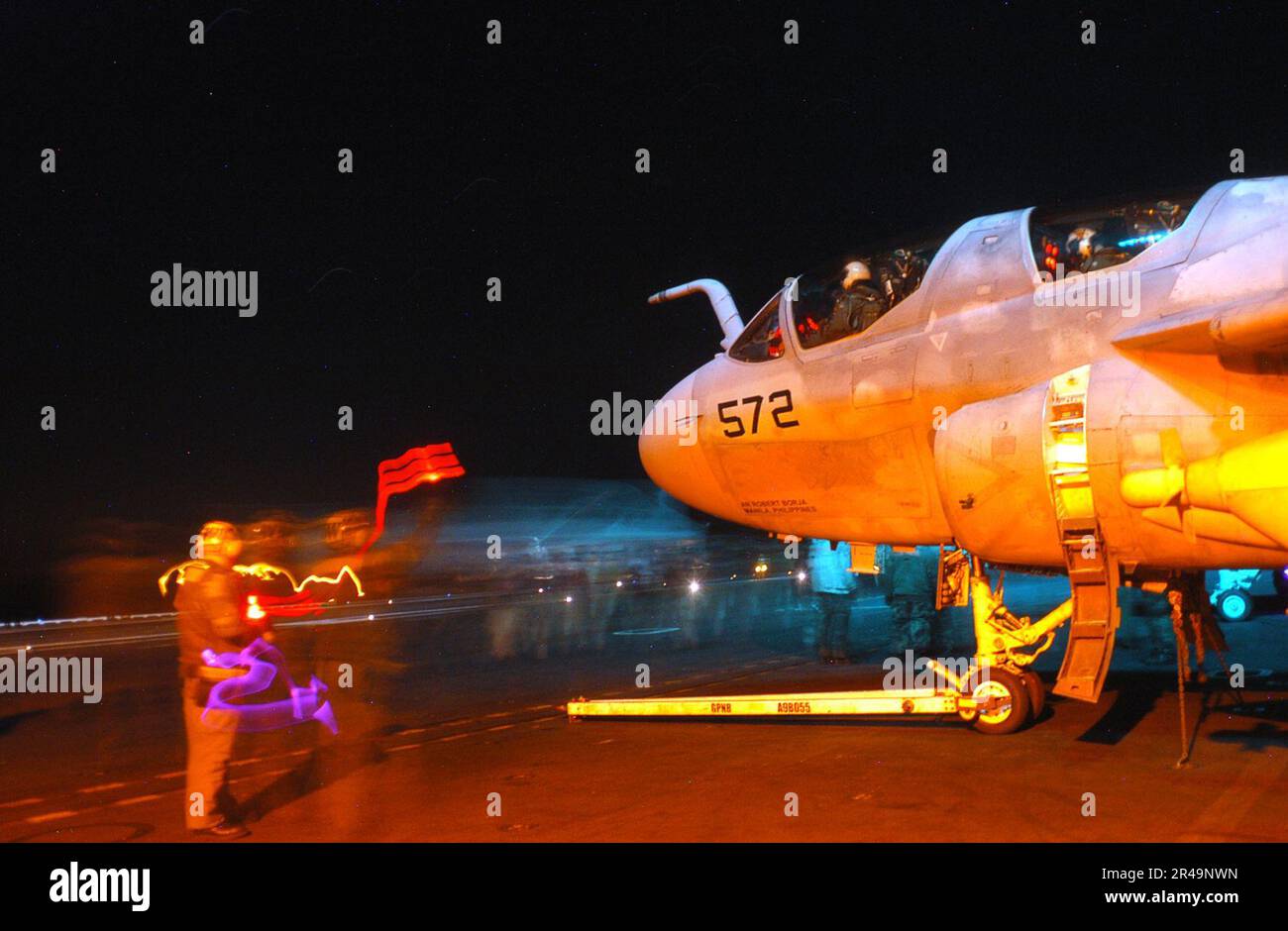 US Navy Aircrew conduct various preflight checks as flight deck ...