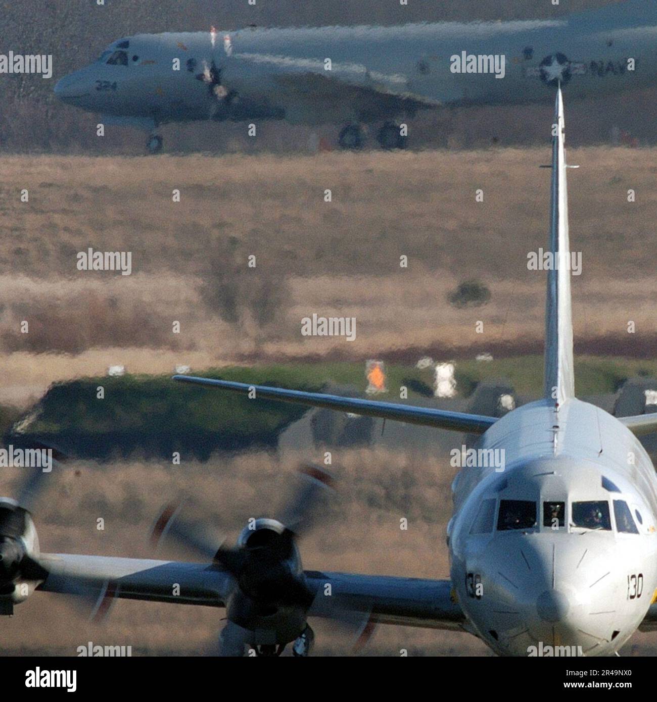 US Navy Two P-3 Orion aircraft taxi on the tarmac Stock Photo - Alamy