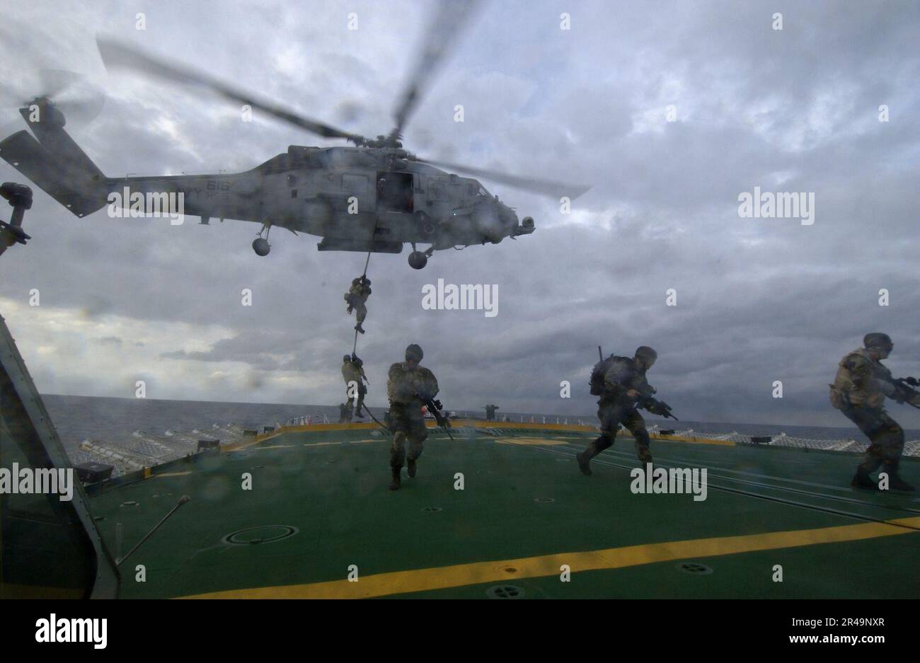 US Navy Members assigned to Explosive Ordnance Disposal Mobile Unit Six ...