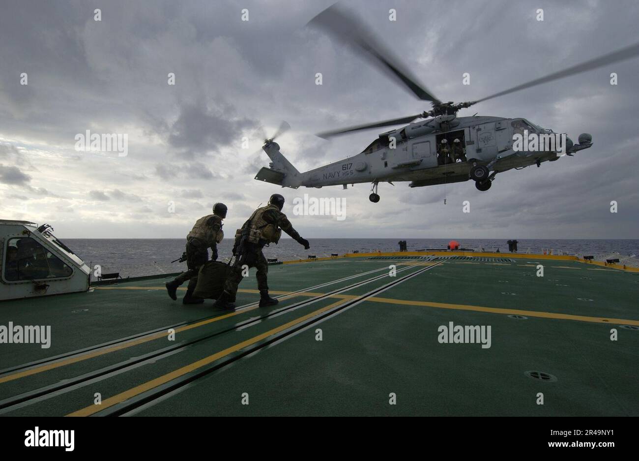 US Navy Members assigned to Explosive Ordnance Disposal Mobile Unit Six ...