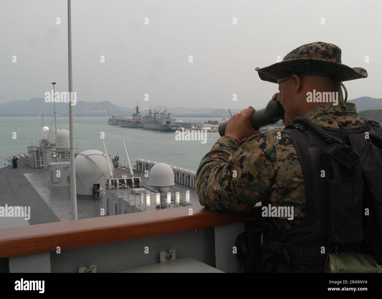 US Navy Lance closely scans the Pattaya Harbor, Thailand, for potential ...