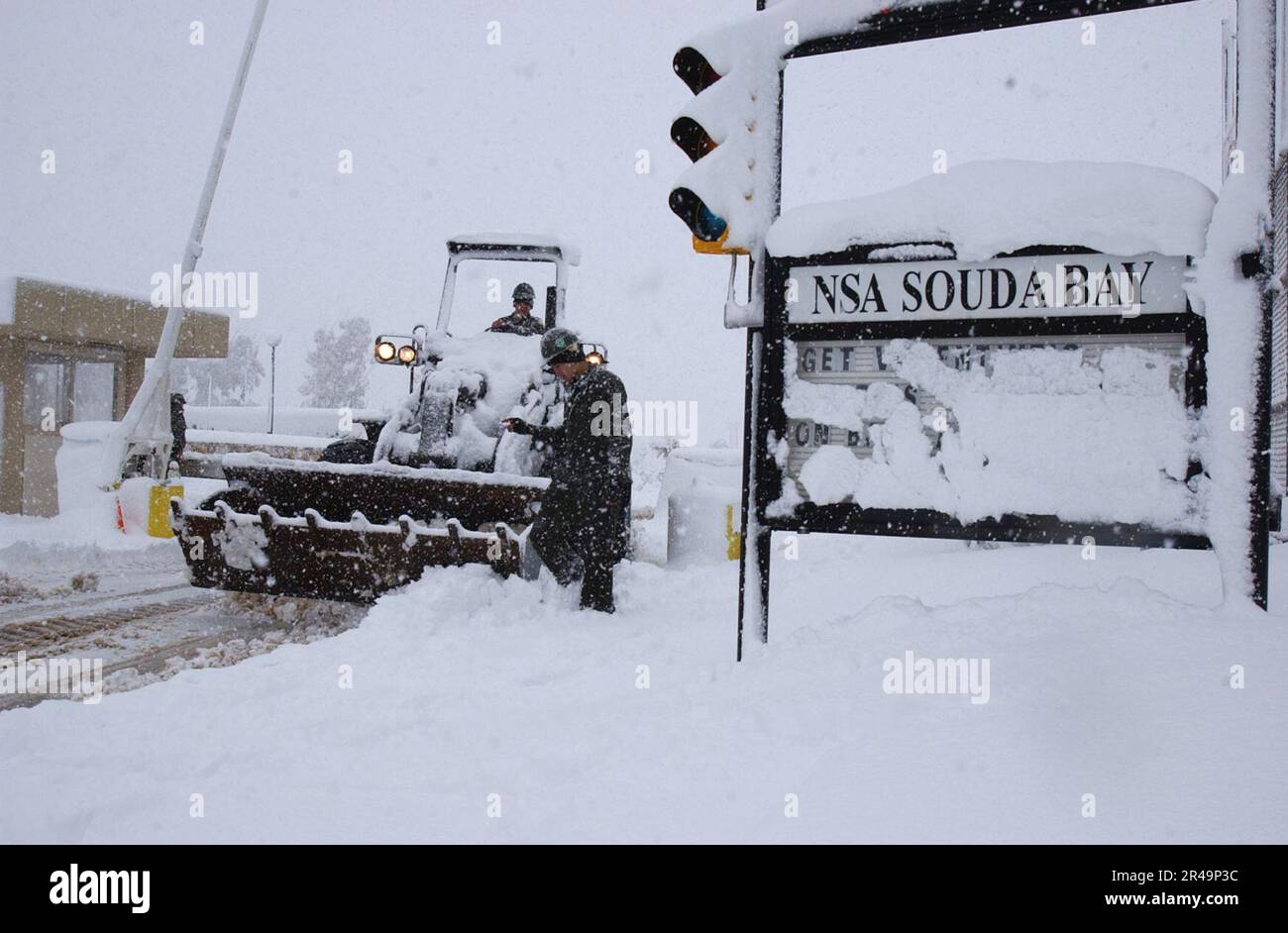 US Navy Equipment Operator Constructionman operates a front-end loader ...