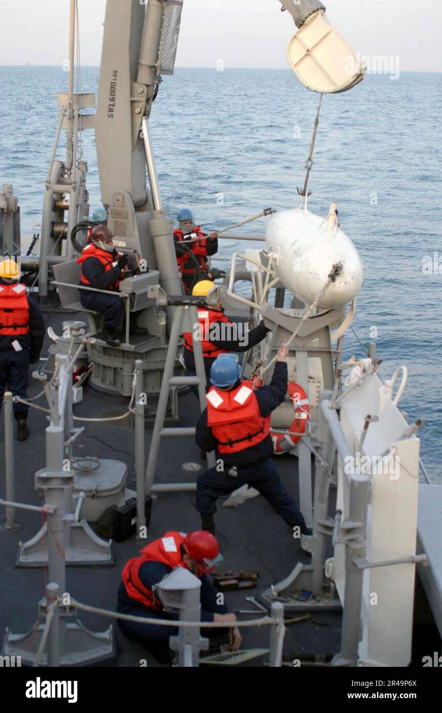 US Navy Deck personnel aboard the mine countermeasure ship USS Guardian ...