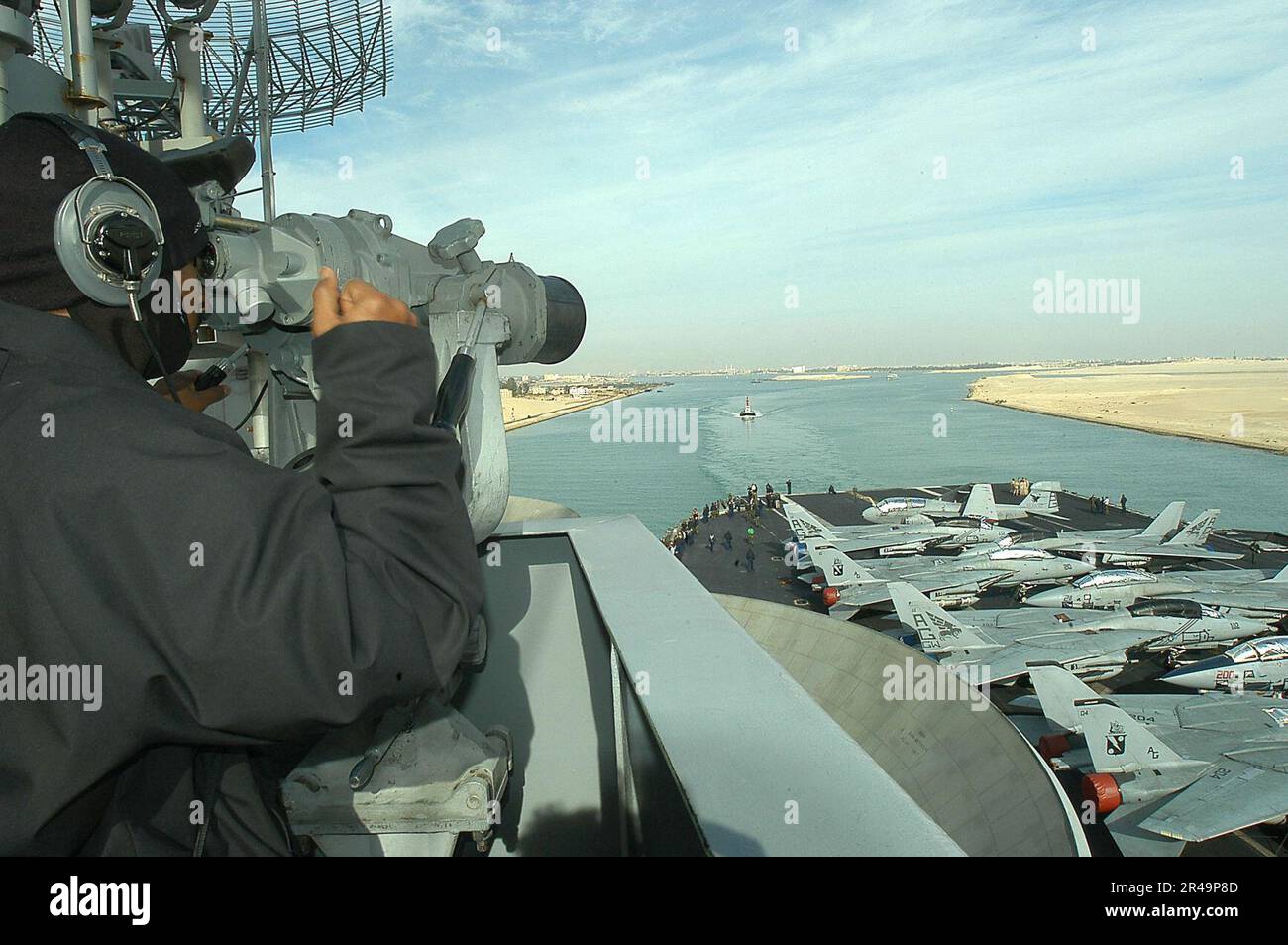 US Navy stands a lookout watch from the signal bridge aboard USS George ...